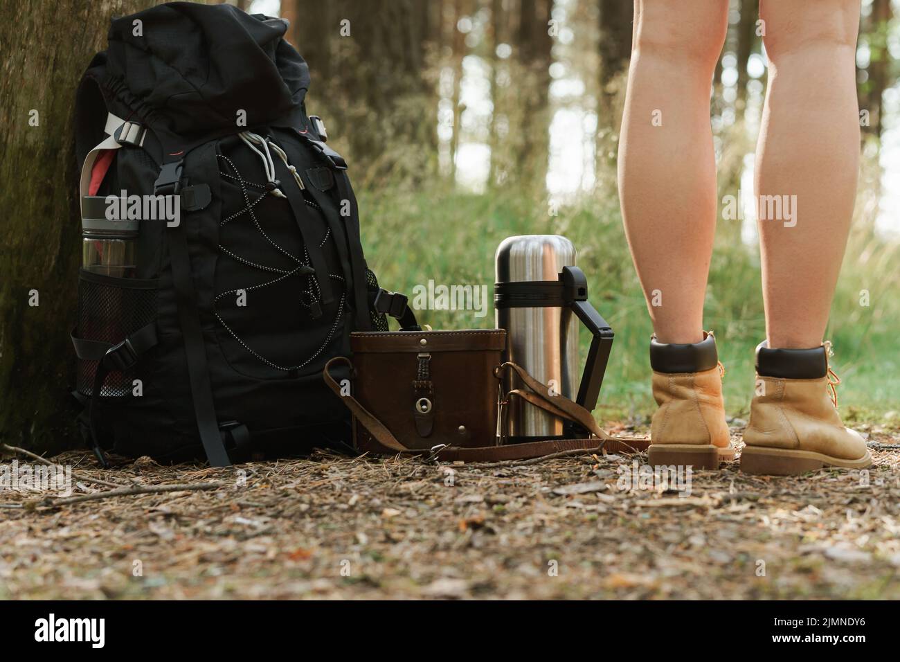 Female legs and hiker's backpack on the ground Stock Photo - Alamy