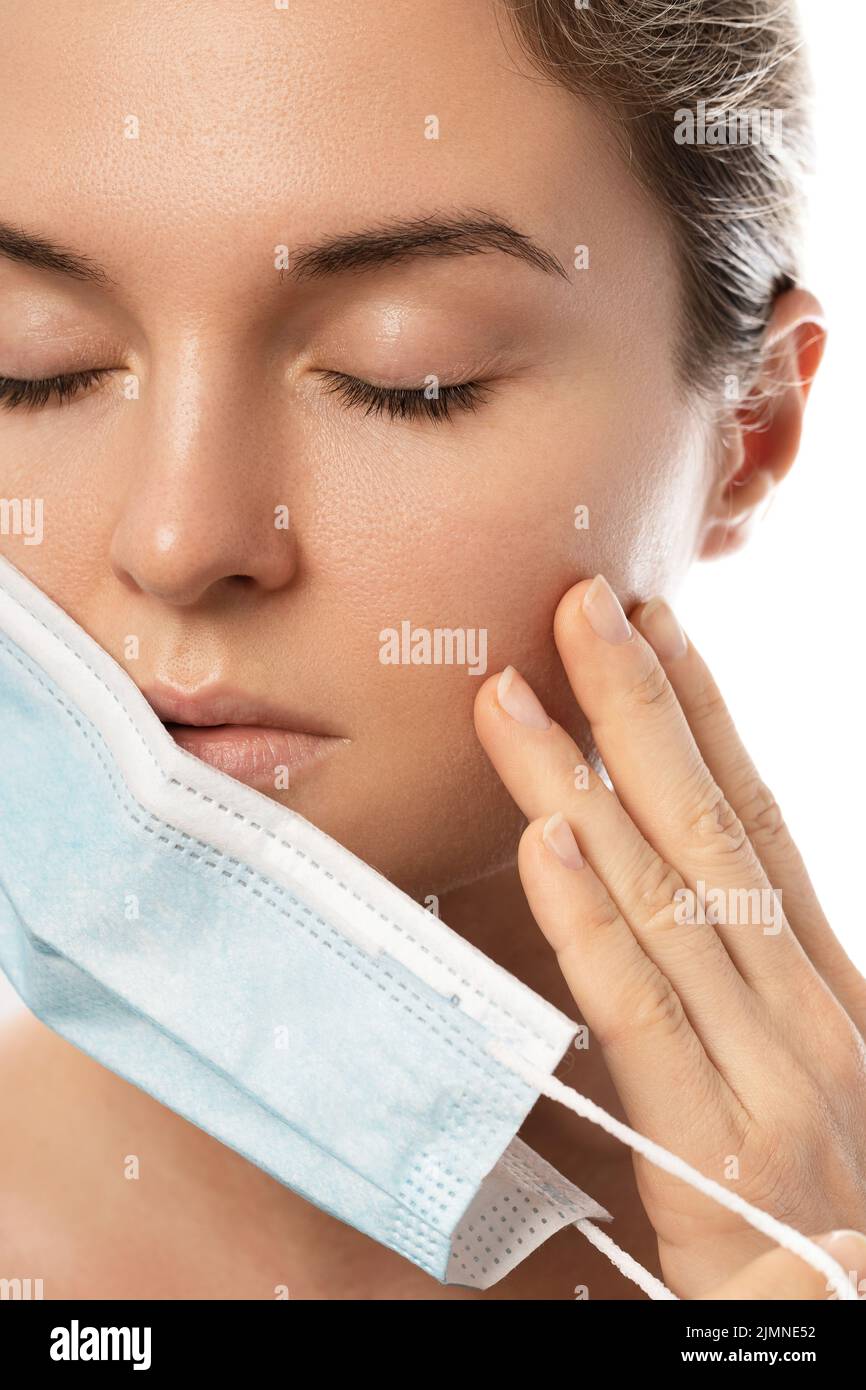 Maskne - acne breakouts from wearing a face mask Stock Photo - Alamy