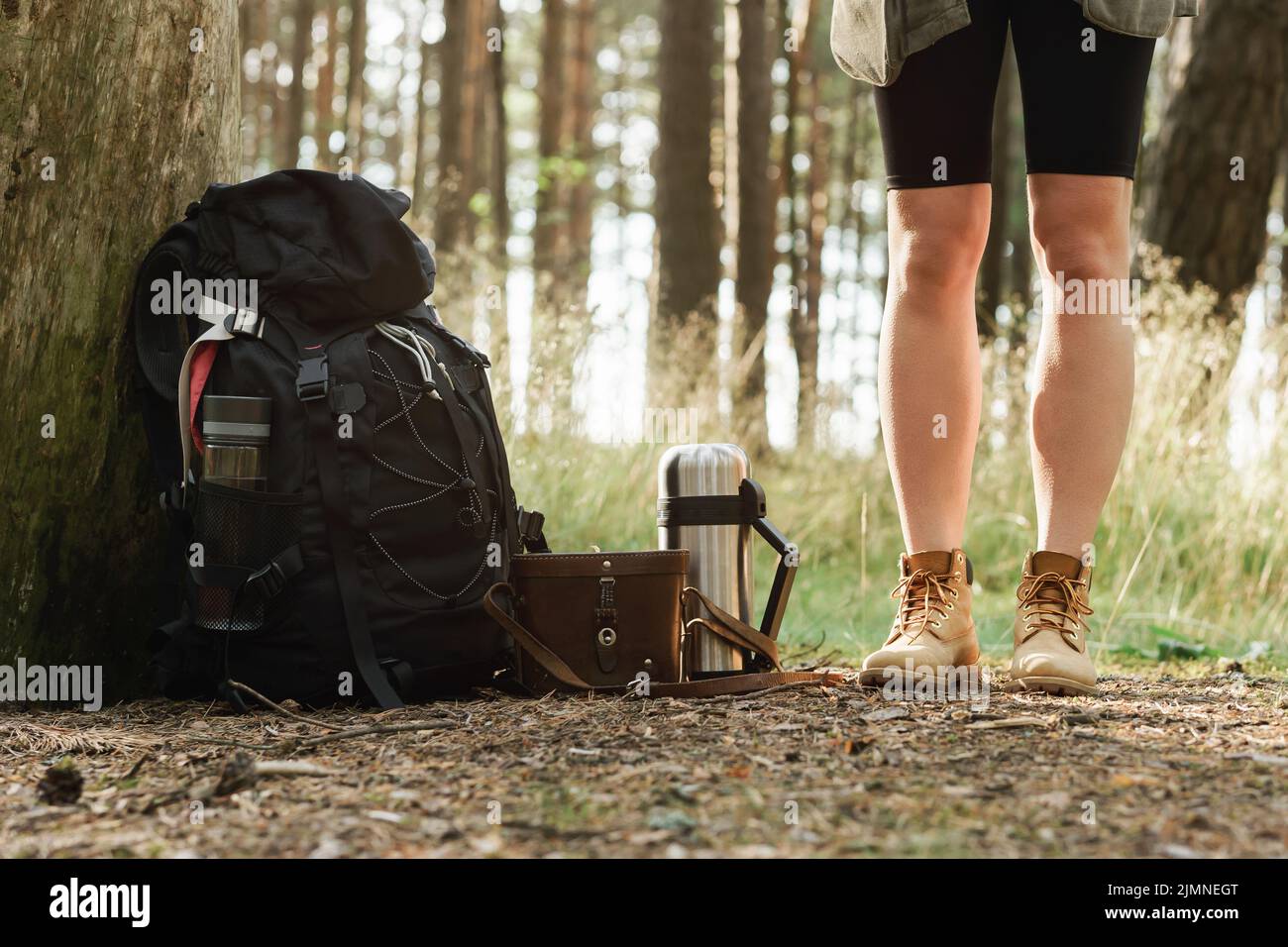 Female legs and hiker's backpack on the ground Stock Photo - Alamy