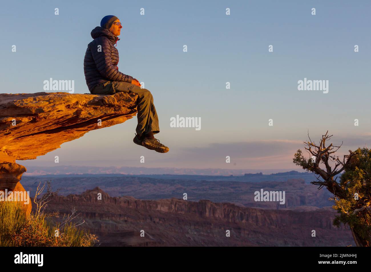 Man on the cliff Stock Photo - Alamy