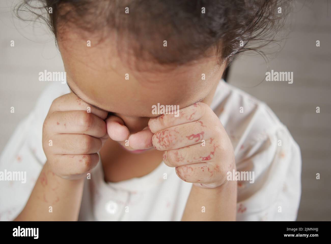 sad upset child girl crying looking down Stock Photo - Alamy