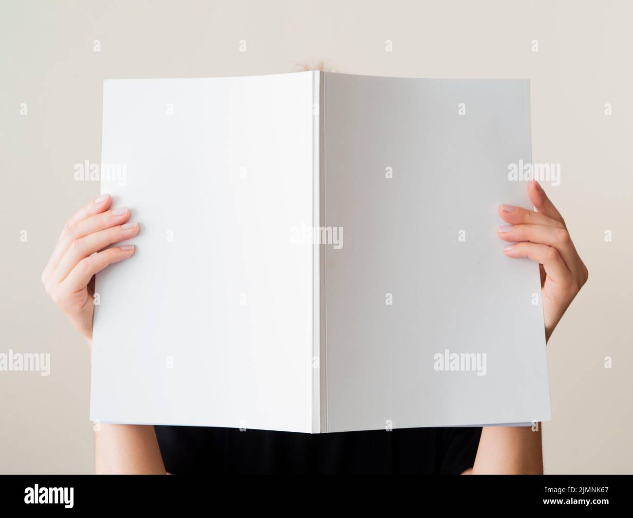 Hands holding magazine cover hi-res stock photography and images - Alamy