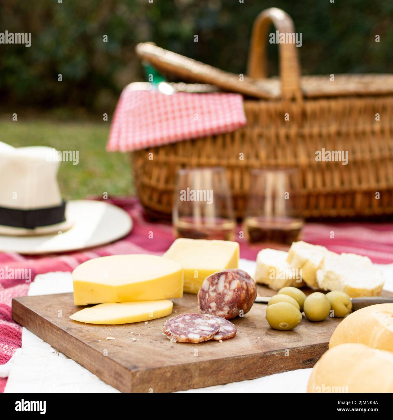 Wooden board with picnic goodies Stock Photo - Alamy