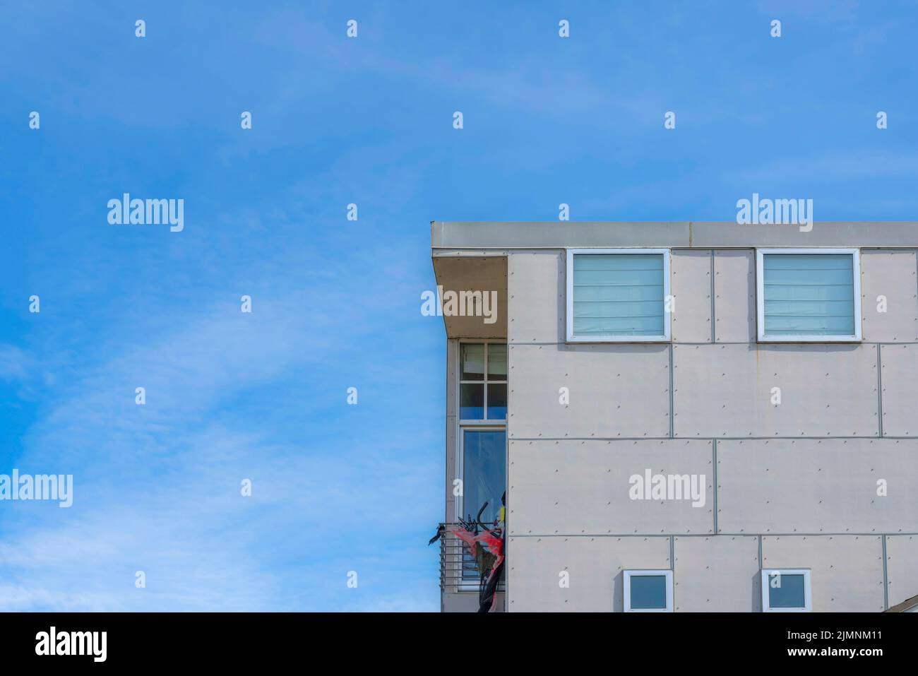 Side view of an apartment building with steel wall claddings in San ...