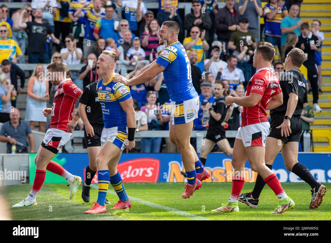 Harry Newman #3 of Leeds Rhinos celebrates his try and makes the score ...