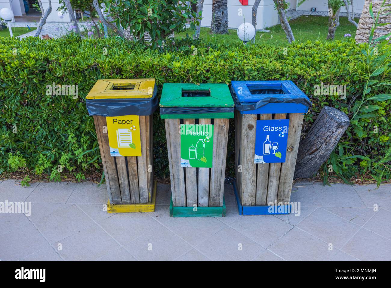 Close up view of station with colorful garbage bins for recycling ...