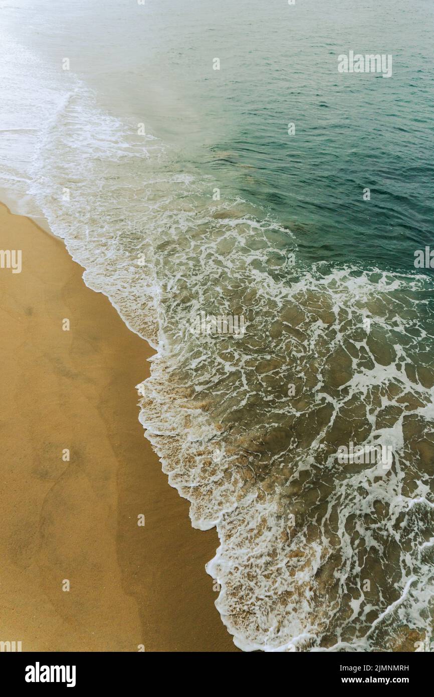 Ocean waves washing sandy shore hi-res stock photography and images - Alamy