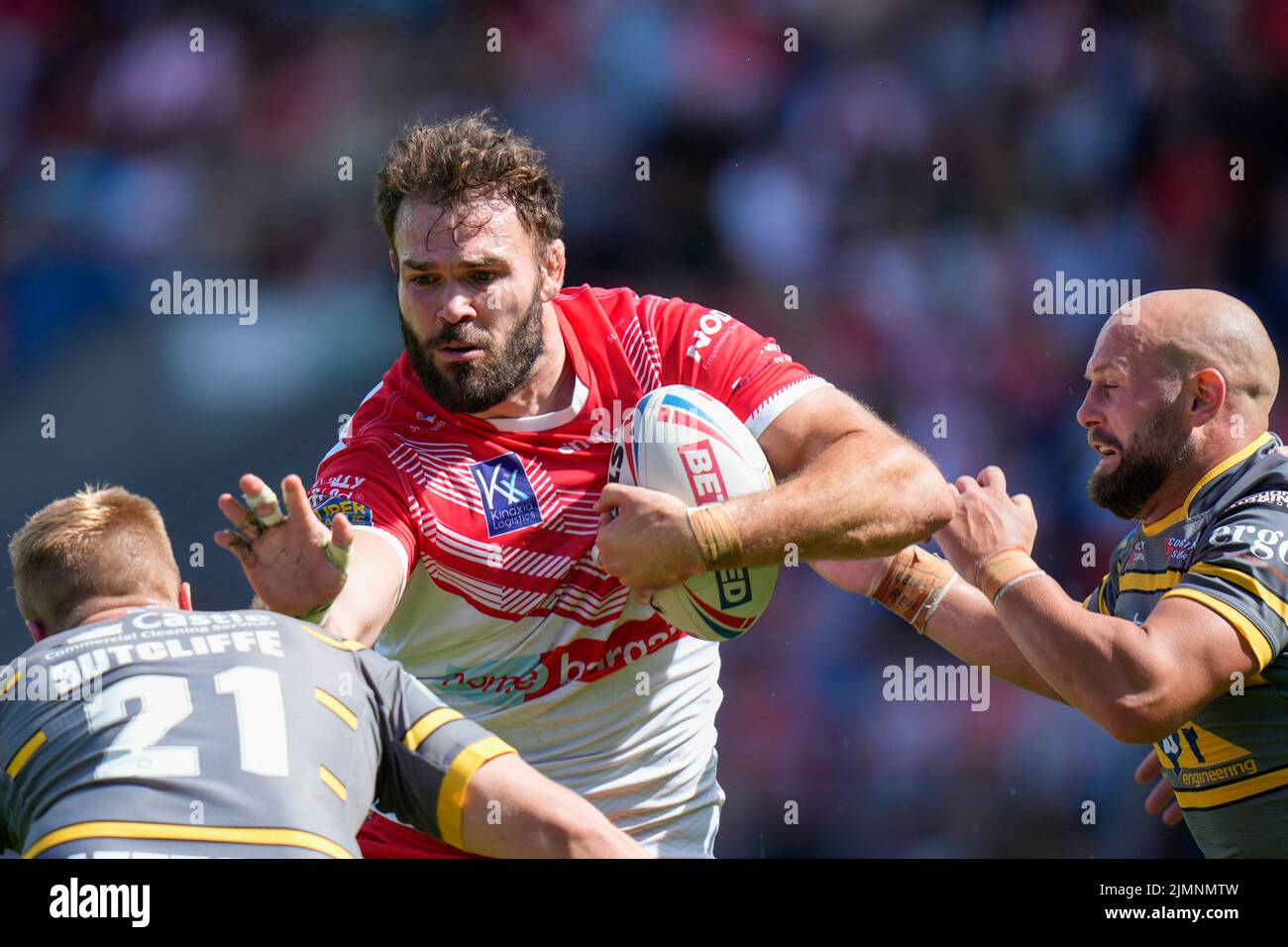 Alex Walmsley #8 of St Helens breaks past Paul McShane #9 and Alex ...