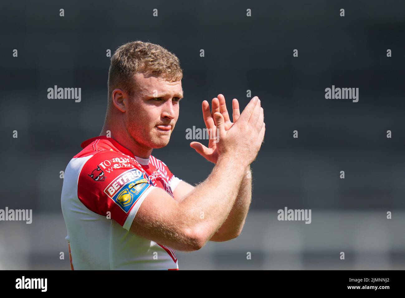 Joey Lussick #14 of St Helens salutes the fans after the game in St ...