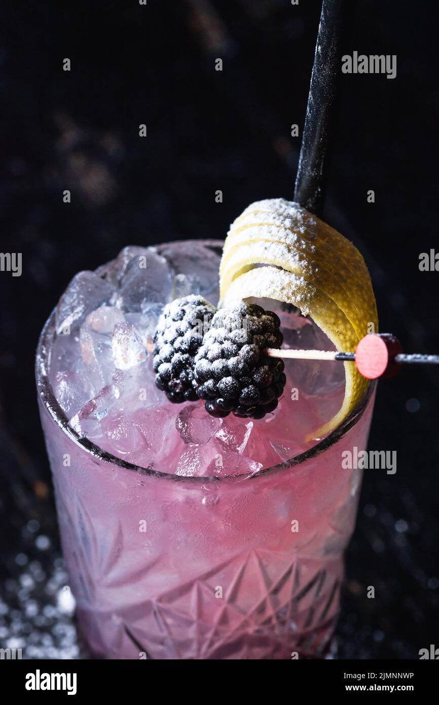 Strawberry cocktail with ice and straw close up Stock Photo - Alamy