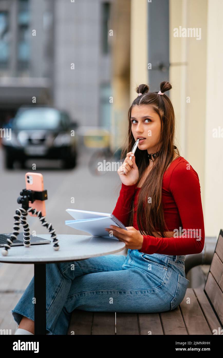 Freelancer woman in a summer cafe doing remote work Stock Photo - Alamy