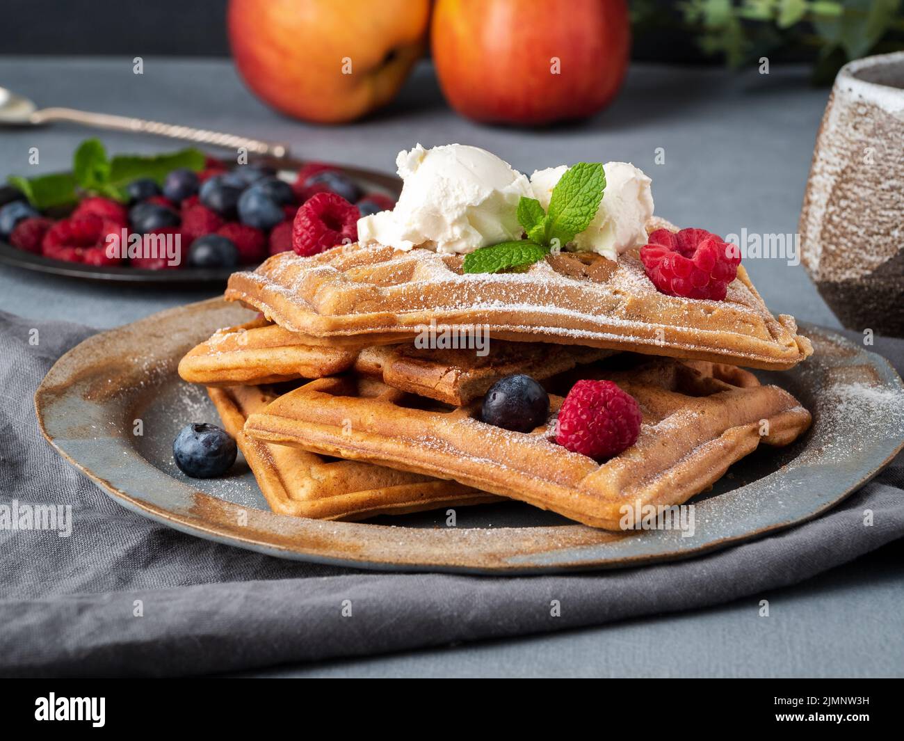 Belgian waffles with raspberries, chocolate syrup. Breakfast with tea ...