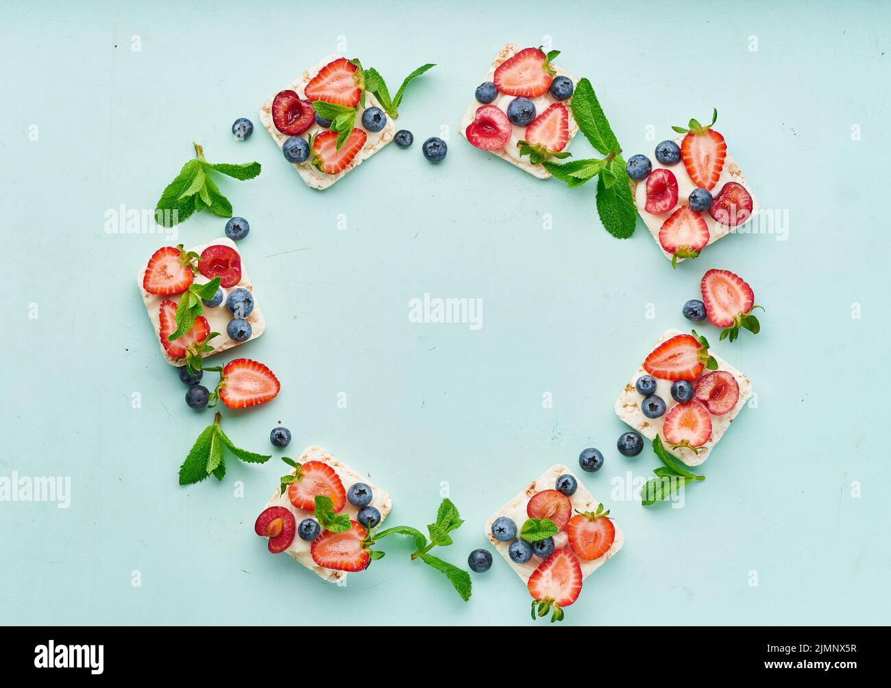 Rise crispbread frame with berries and fruits colorful concept on ...