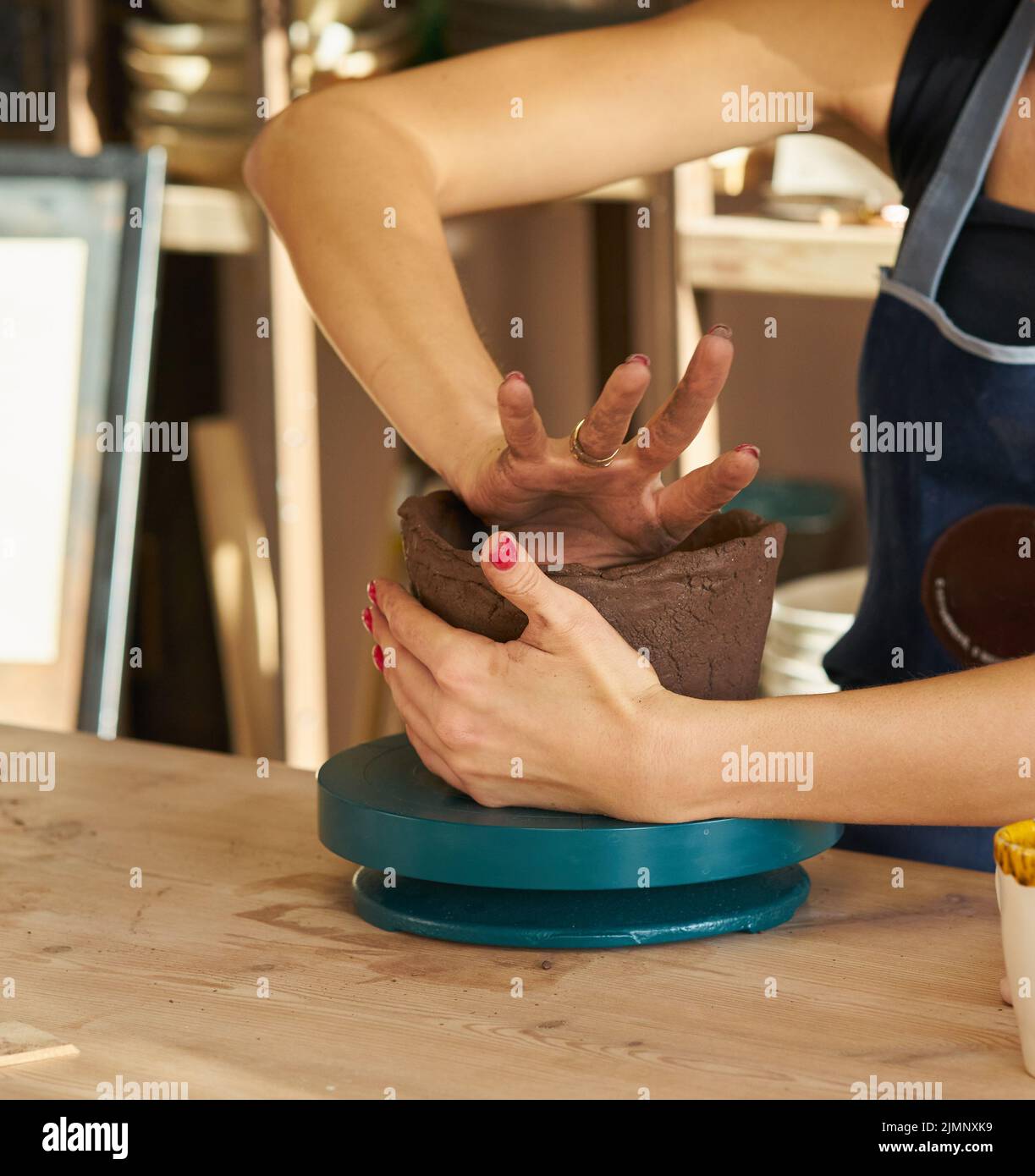 Woman making ceramic pottery, hands closeup, focus on potters, palms ...