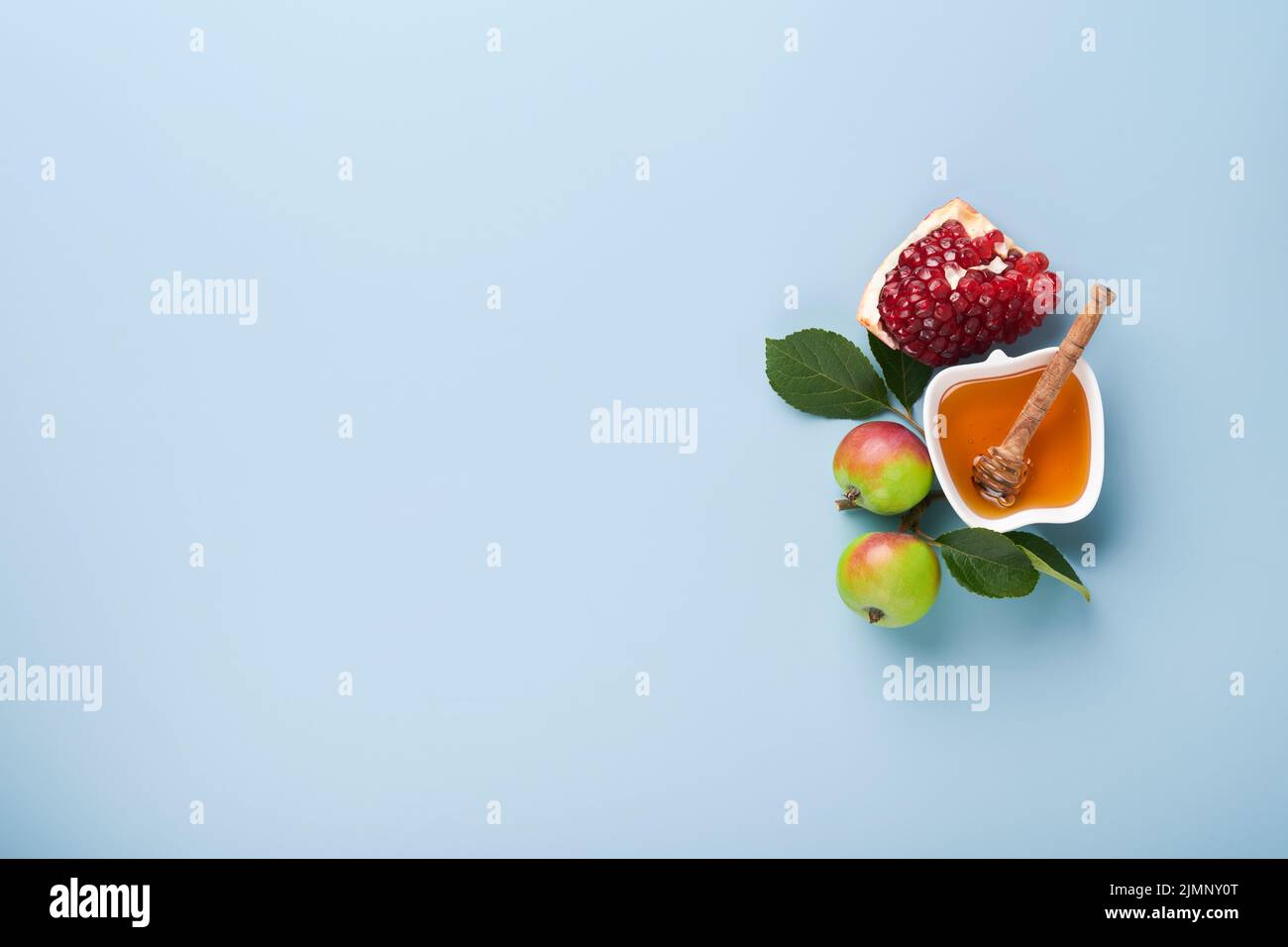 Rosh Hashanah. Honey jar, honeycomb, apple and pomegranate on simple ...
