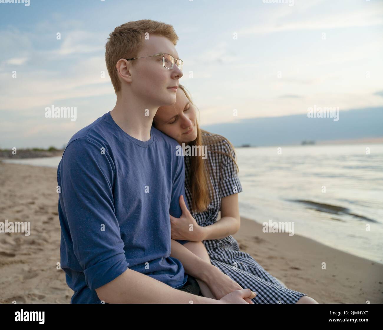 Boyfriend girlfriend sitting hi-res stock photography and images - Alamy