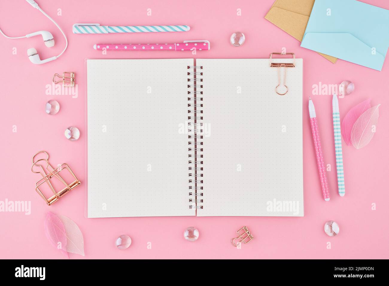 Blank notepad page in bullet journal on bright pink office desktop. Top ...