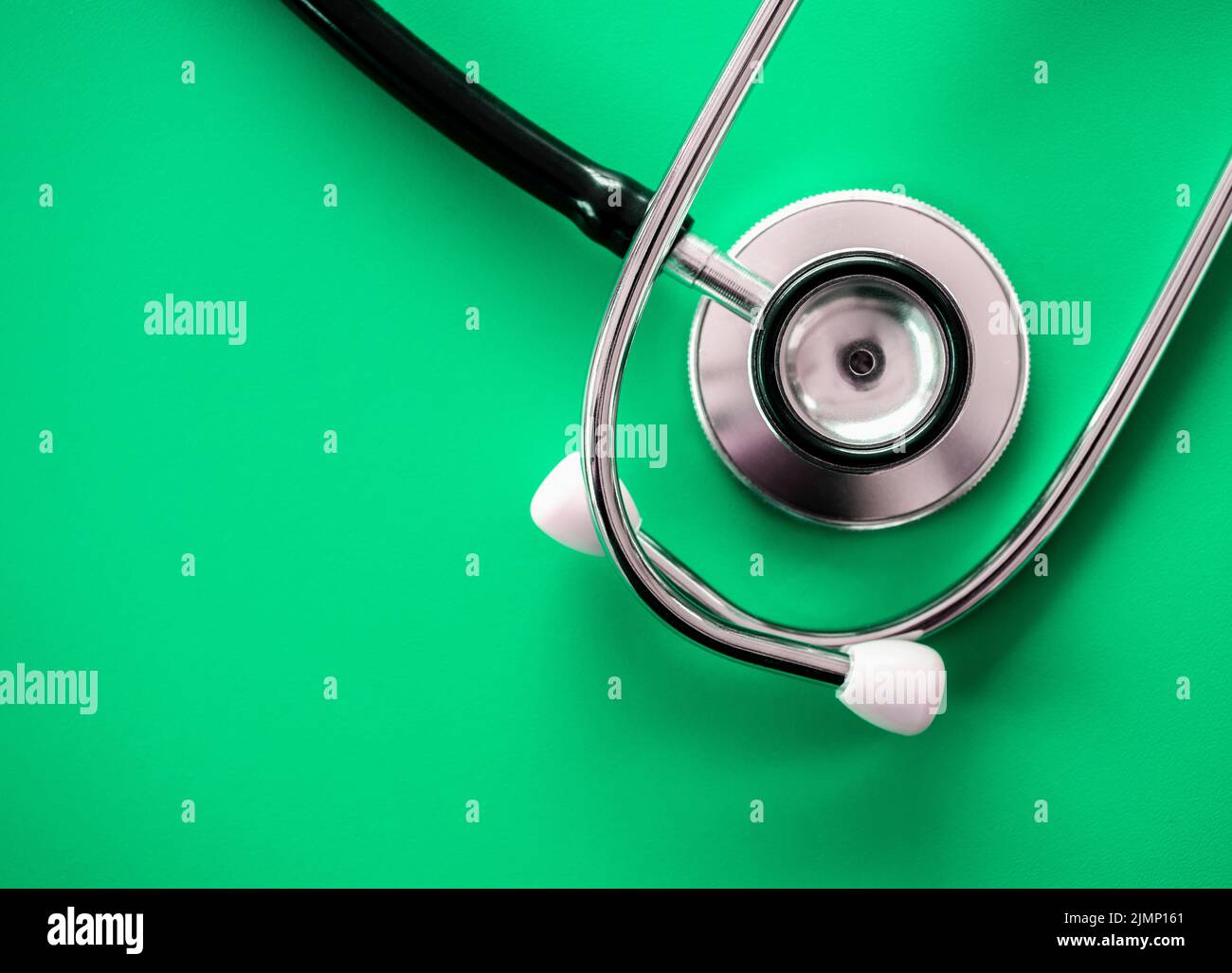 Close up stethoscope isolated on light green background with copy space ...