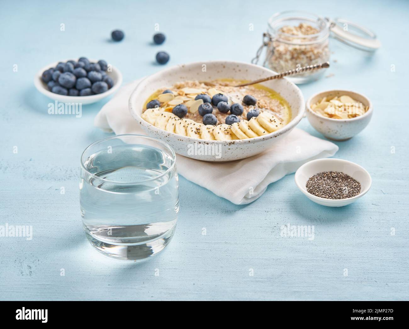 Glass of clean water and healthy diet breakfast with oatmeal ...