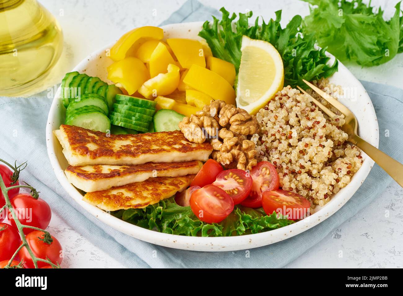 Buddha bowl with halloumi, quinoa, salad lettuce, vegeterian food ...