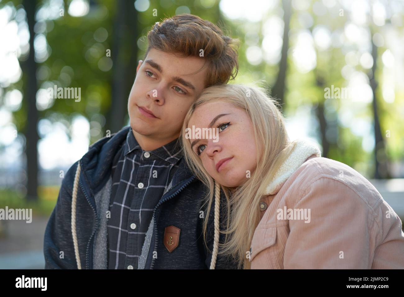 Teenagers in love dreaming in the rays of autumn sun. Concept of teen ...