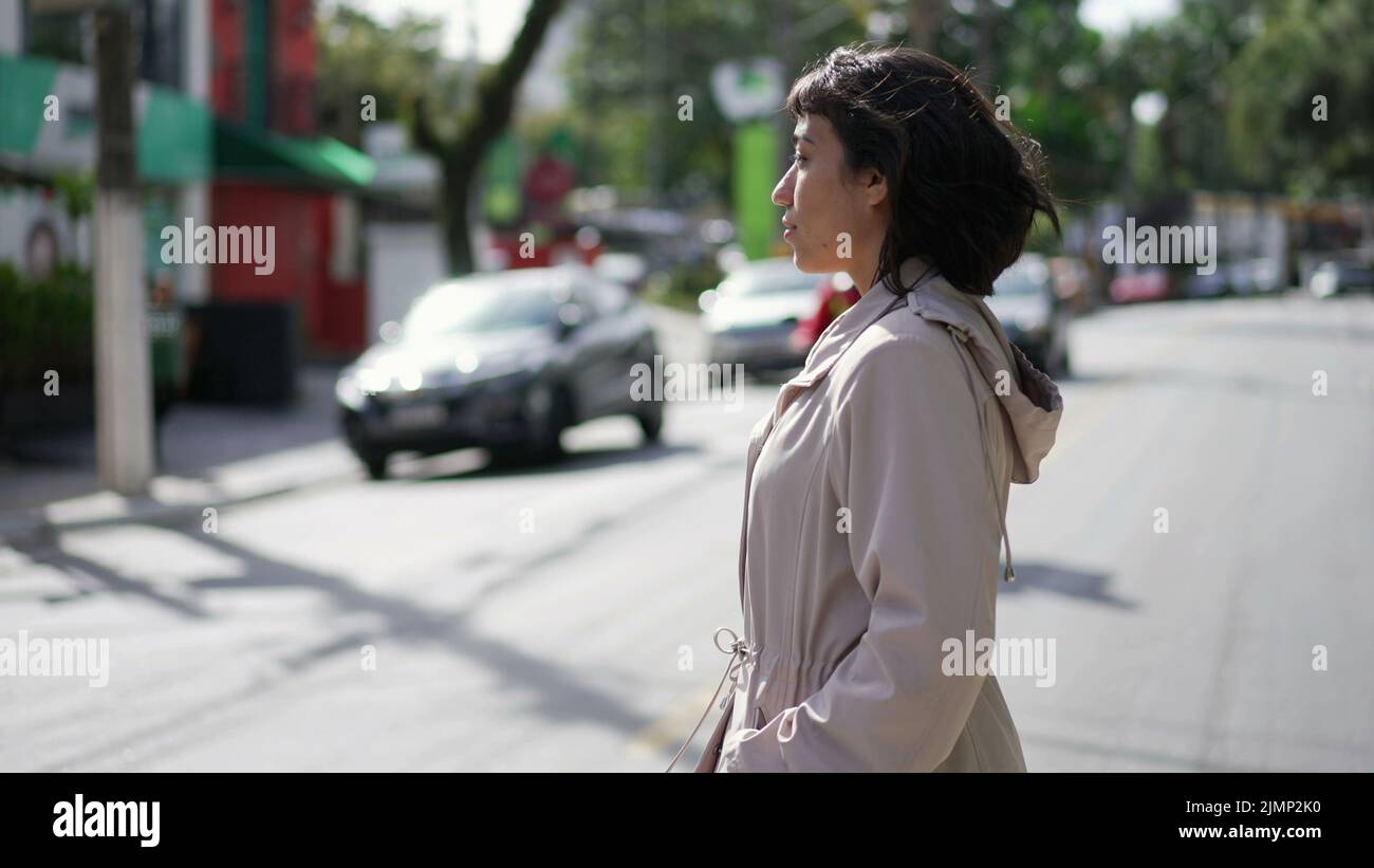 Person crosses downtown street hi-res stock photography and images - Alamy