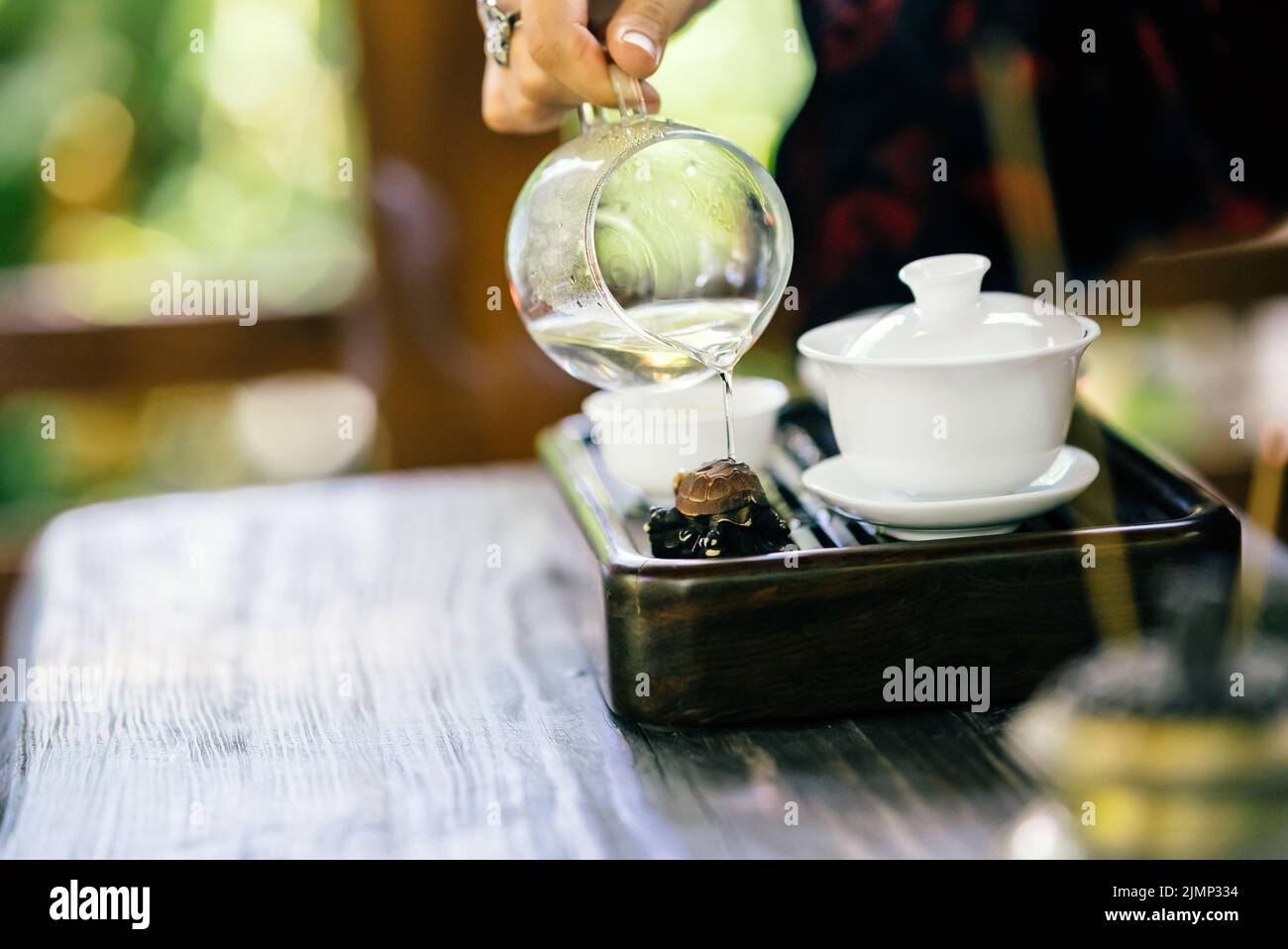 Process brewing tea. Woman steeping herbal tea Stock Photo - Alamy