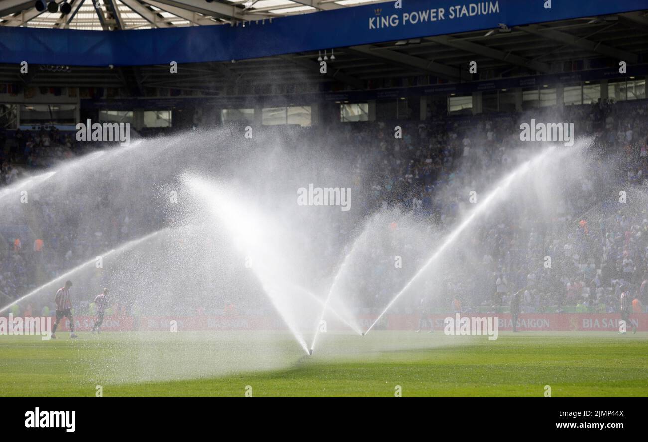 Sprinklers water the pitch at half time during the Premier League match ...
