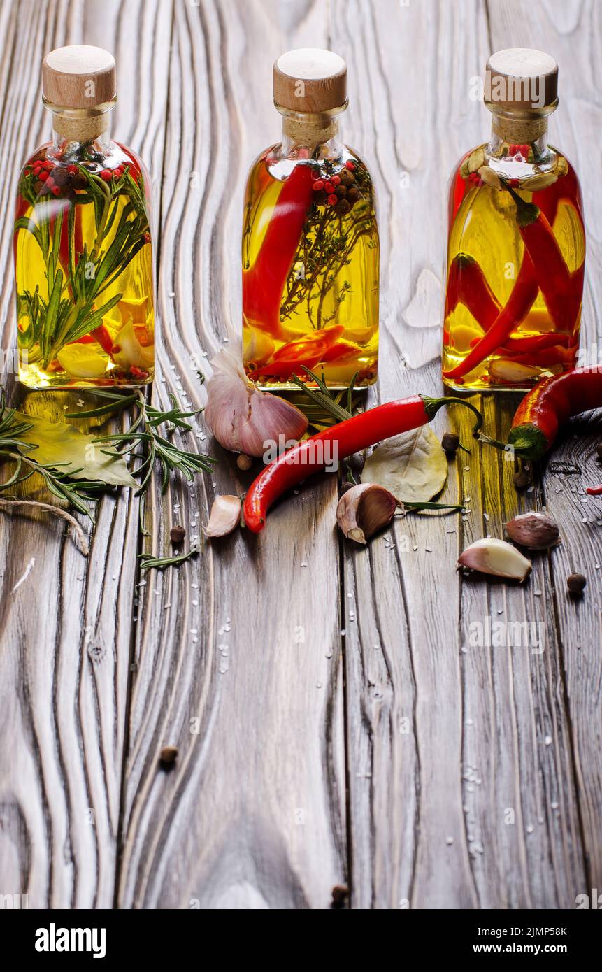 Food background made of oils condiments and spices on kitchen table ...