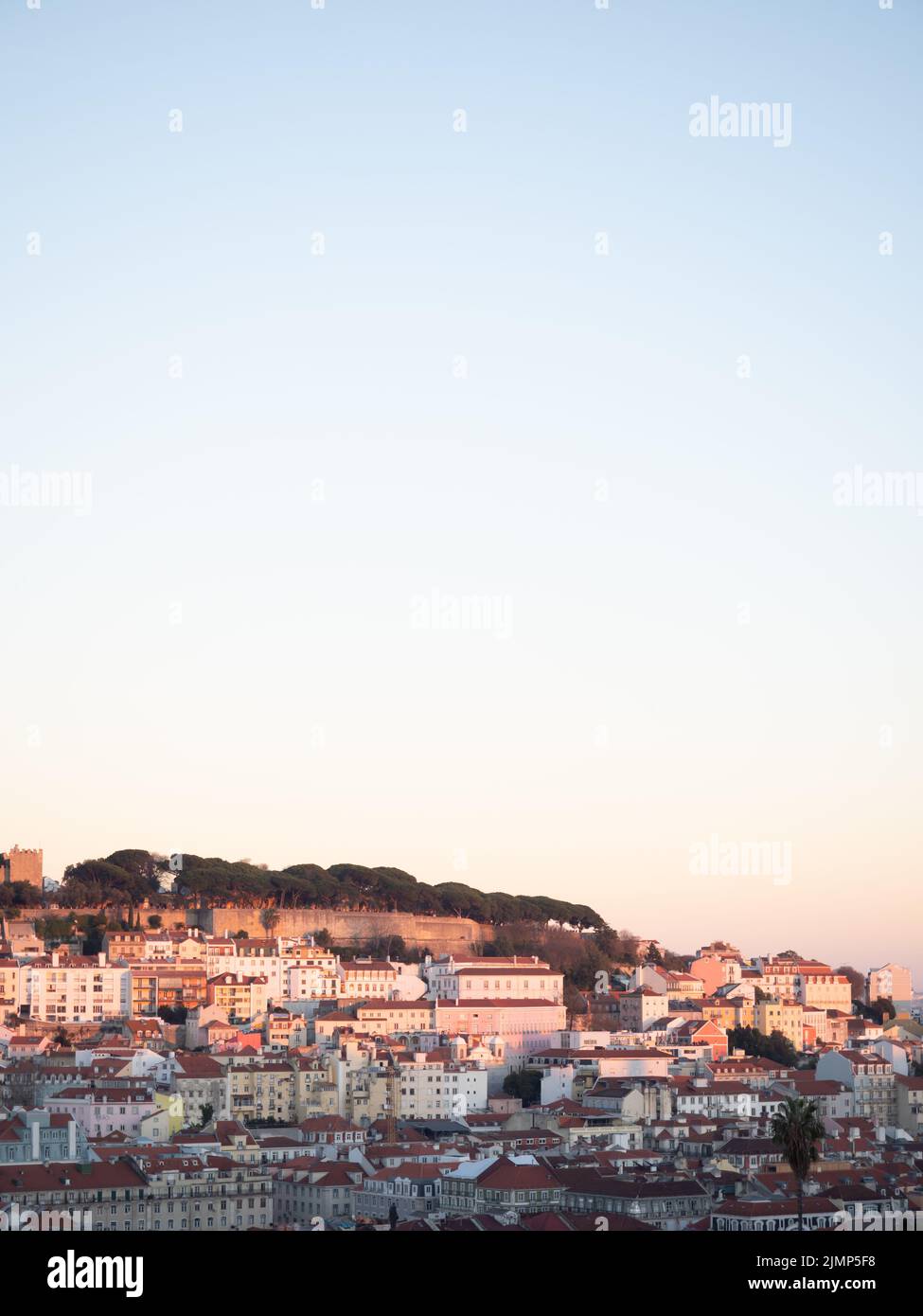 Dusky pink sunset, sun setting with glow at golden hour in Lisbon ...