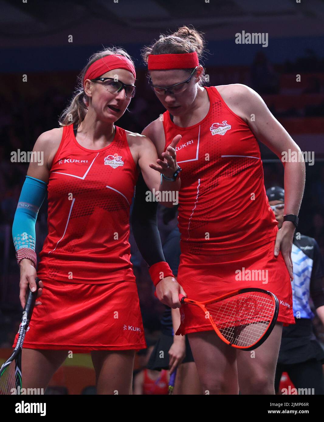 England's Sarah-Jane Perry (right) and Alison Waters in action against Malaysia's Rachel Arnold ...