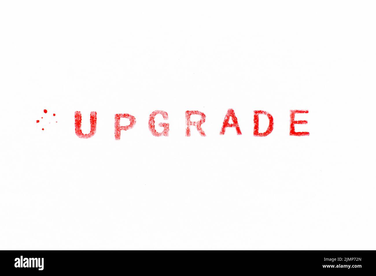 Red color ink rubber stamp in word upgrade on white paper background ...