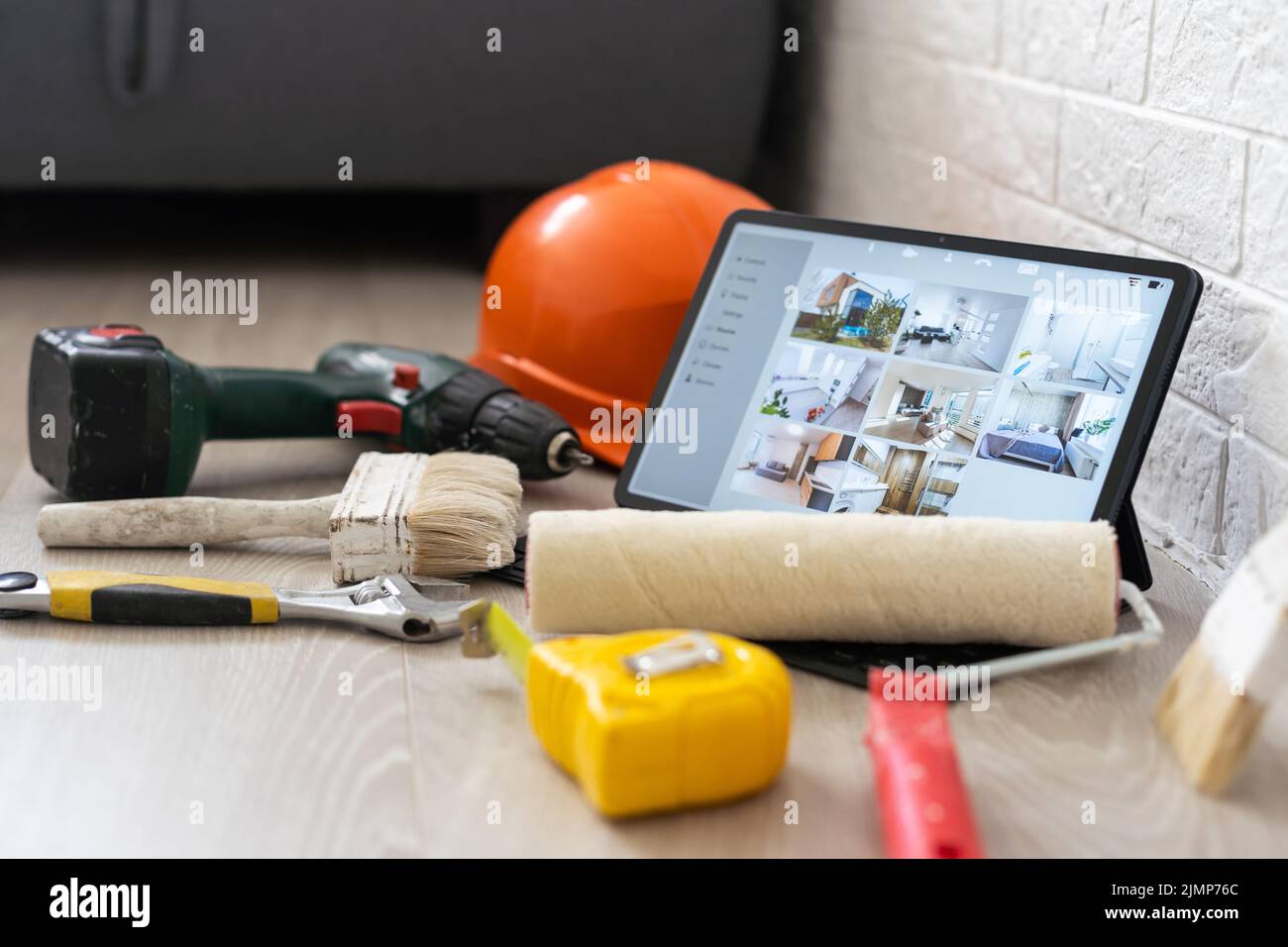 repair, diy and home improvement concept - close up of tablet pc ...