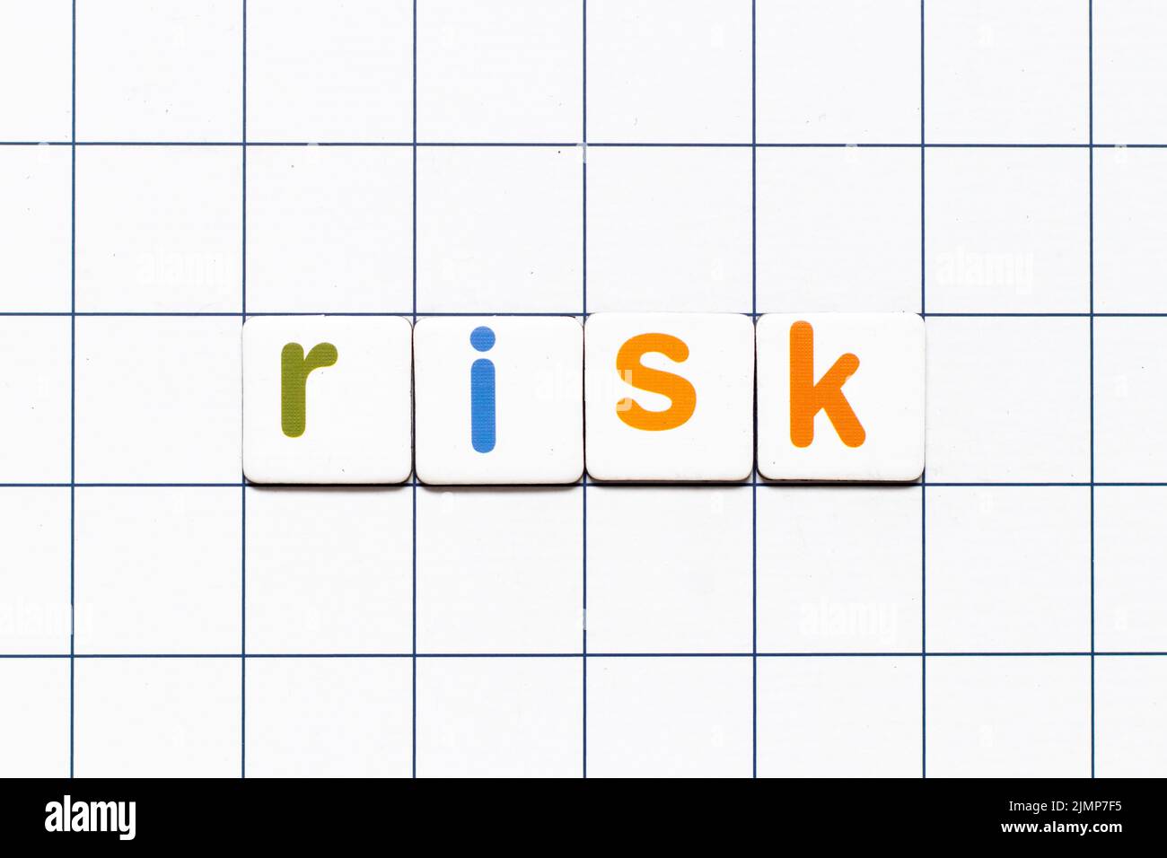 Colorful tile letter in word risk on white grid background Stock Photo ...
