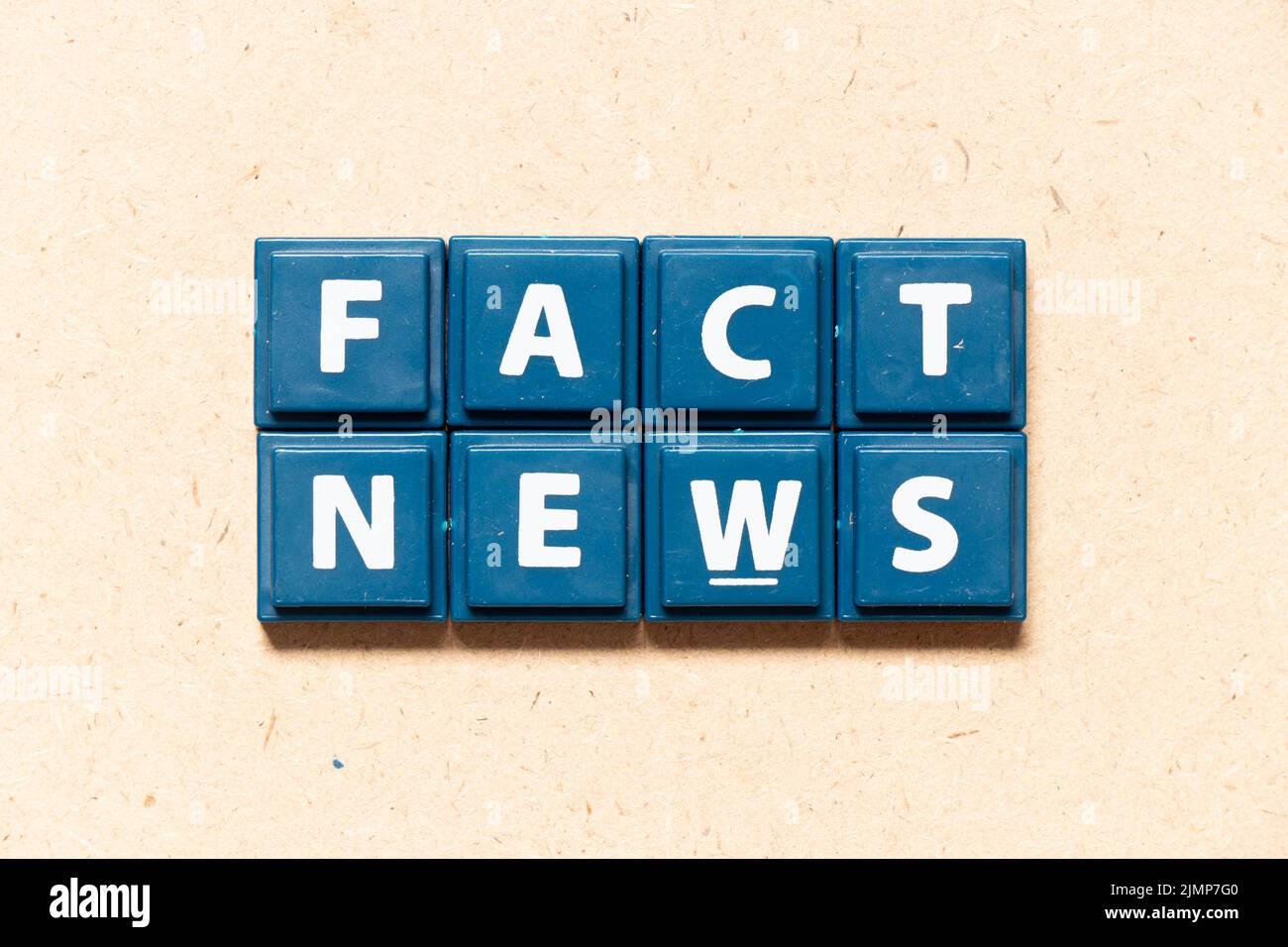 Tile letter in english word fact news on wood background Stock Photo ...