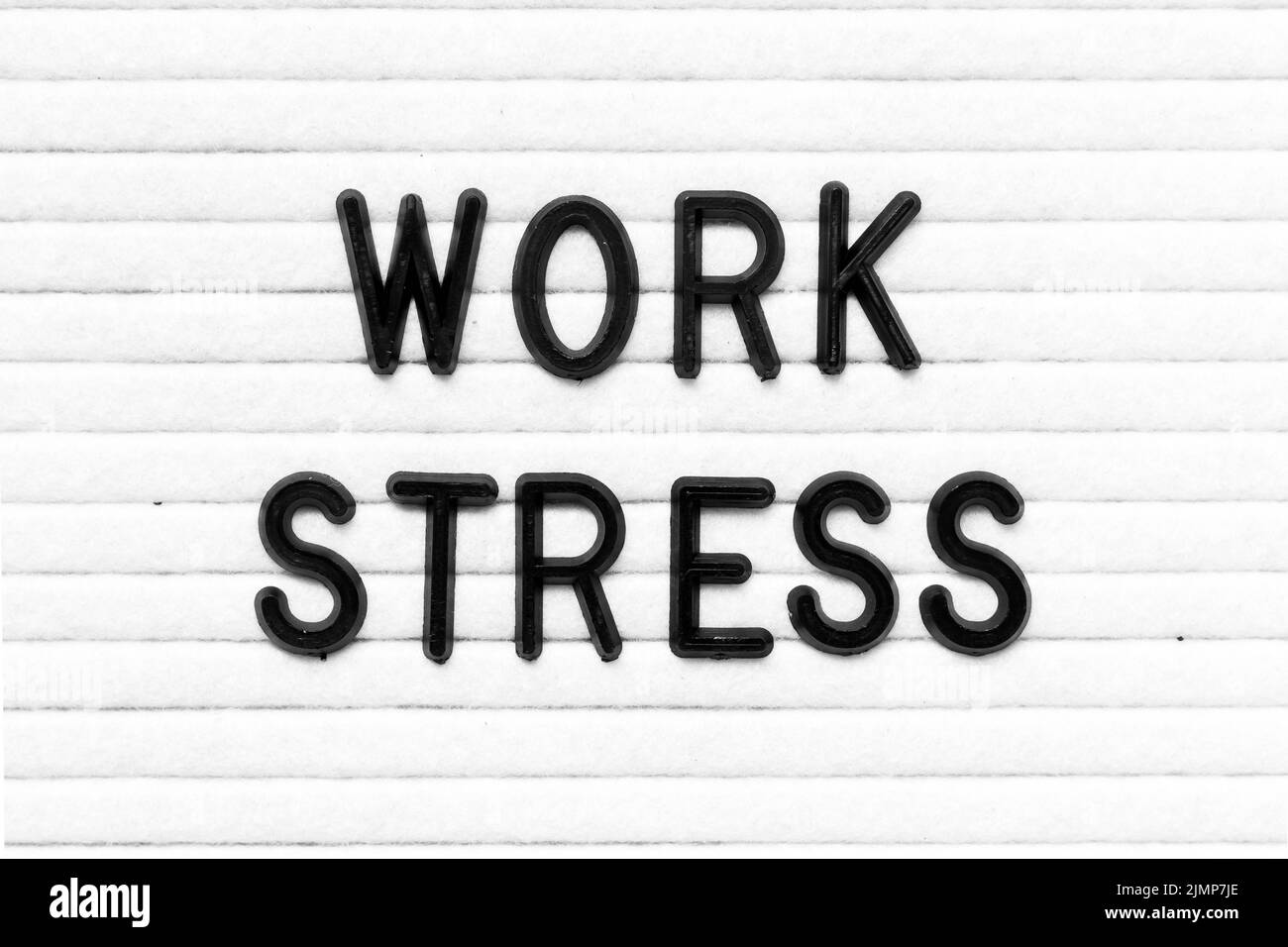 Black color letter in word work stress on white felt board background ...