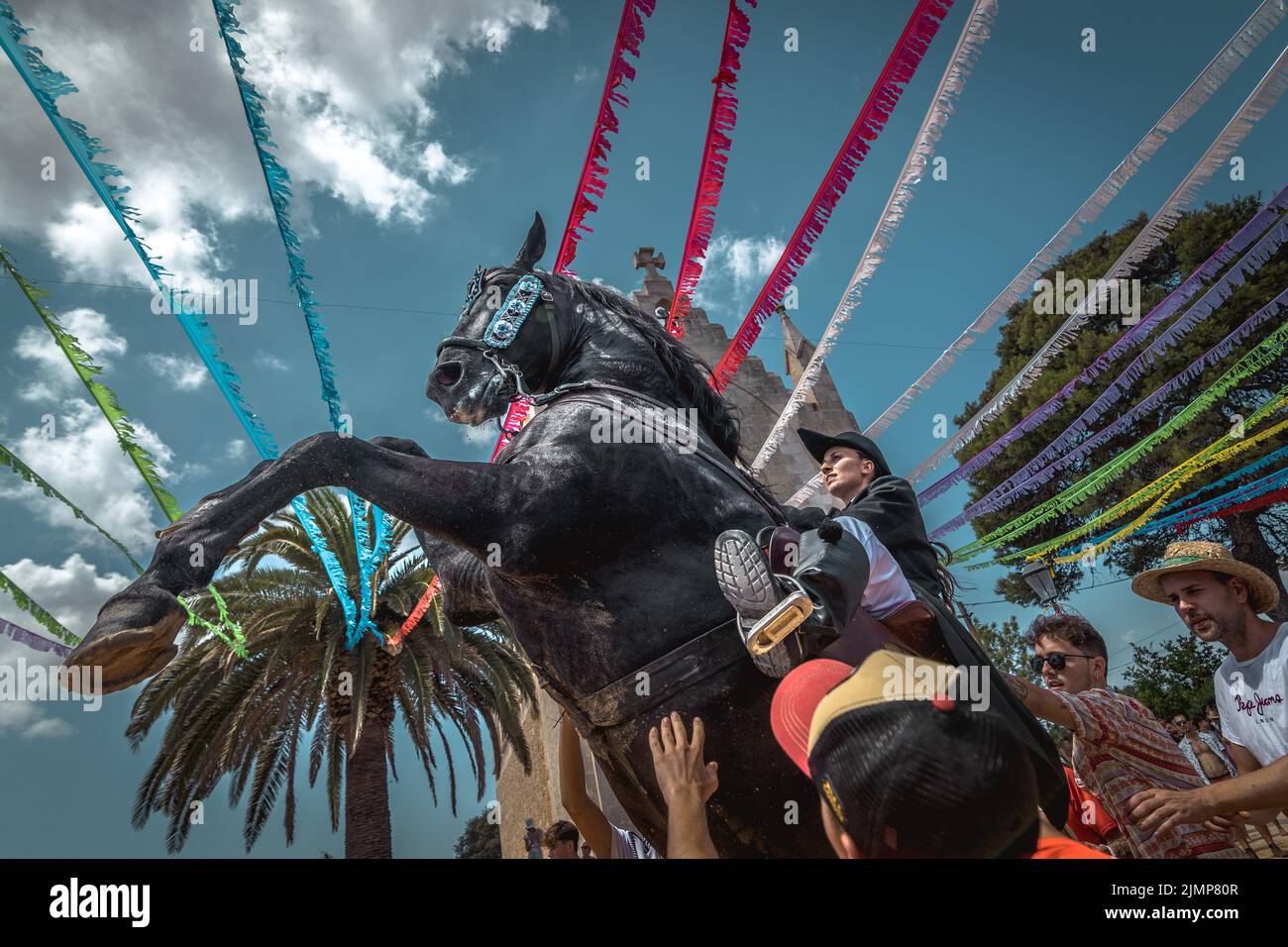 Llucmacanes, Spain. 7th Aug, 2022. A 'caixer' (horse rider) rears up on ...