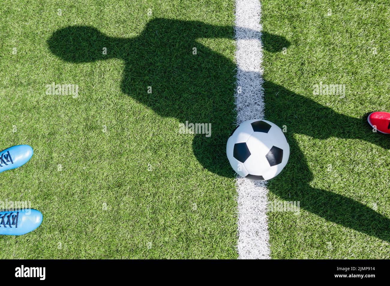 Soccer football sport background. Soccer ball and shadow of player on ...