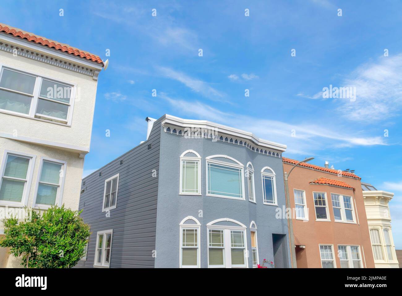 Suburban houses with pastel colors exterior in a low angle view in San ...