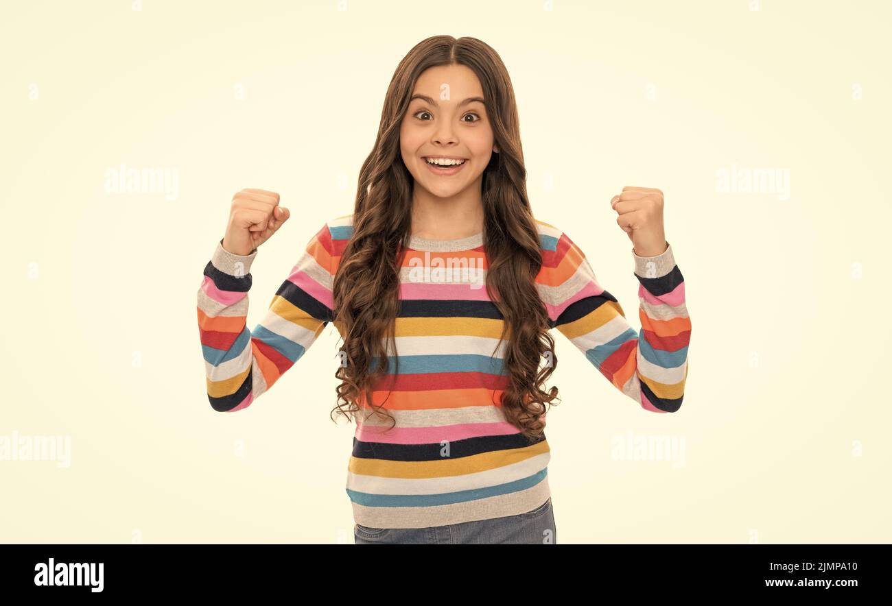 Happy kid smile making winning hand gesture isolated on white, winner ...