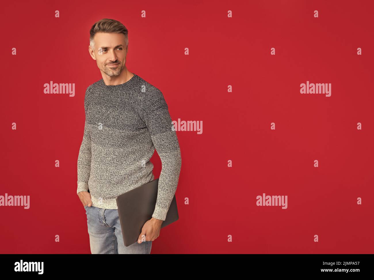 happy man holding laptop on red background, freelancer Stock Photo - Alamy