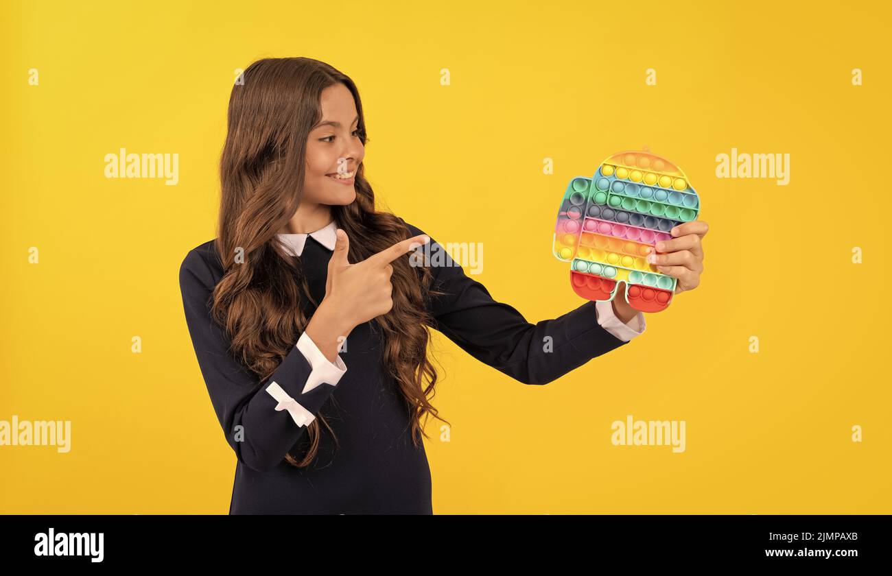 sensory fidgeting. girl with finger game. kid popping anti stress ...