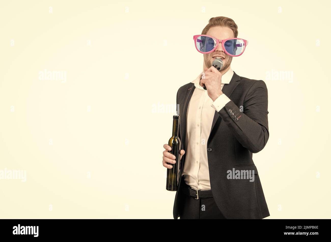 Keep calm and karaoke. Professional man sing to microphone. Karaoke ...