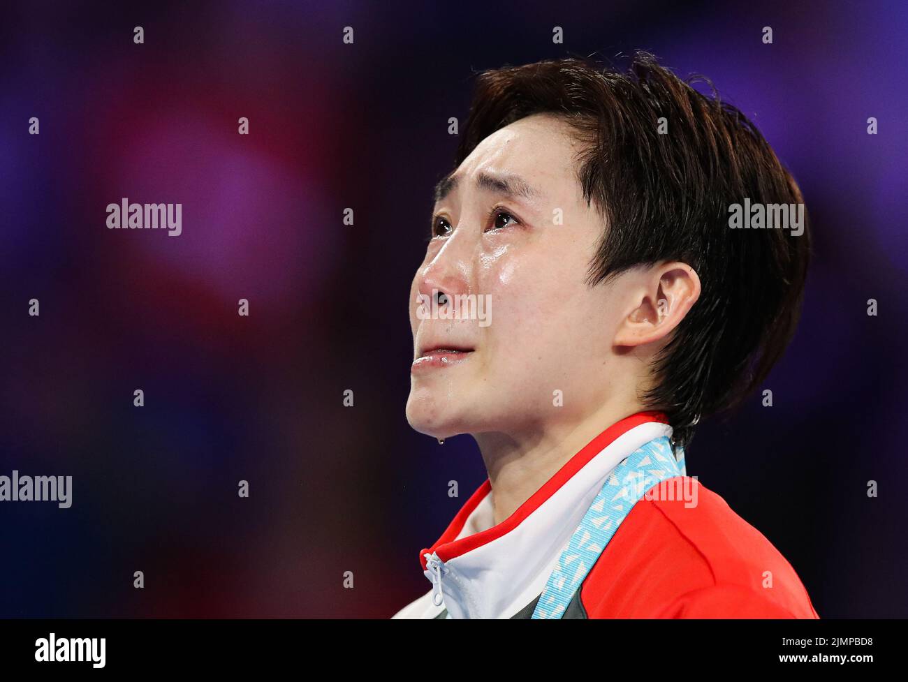 Singapore’s Tianwei Feng celebrates victory during their Table Tennis ...