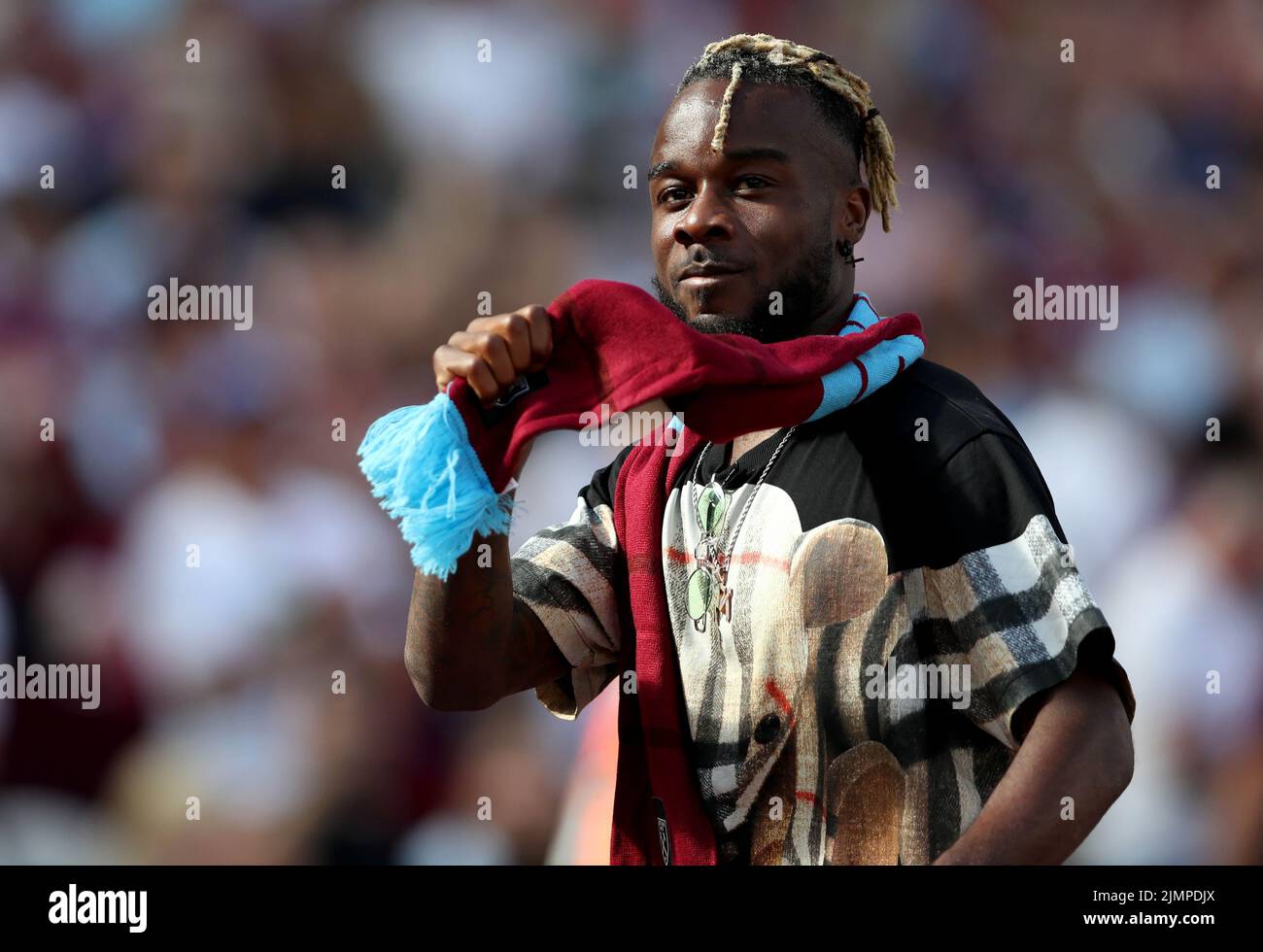 West Ham United's Maxwell Cornet is unveiled on the pitch after ...