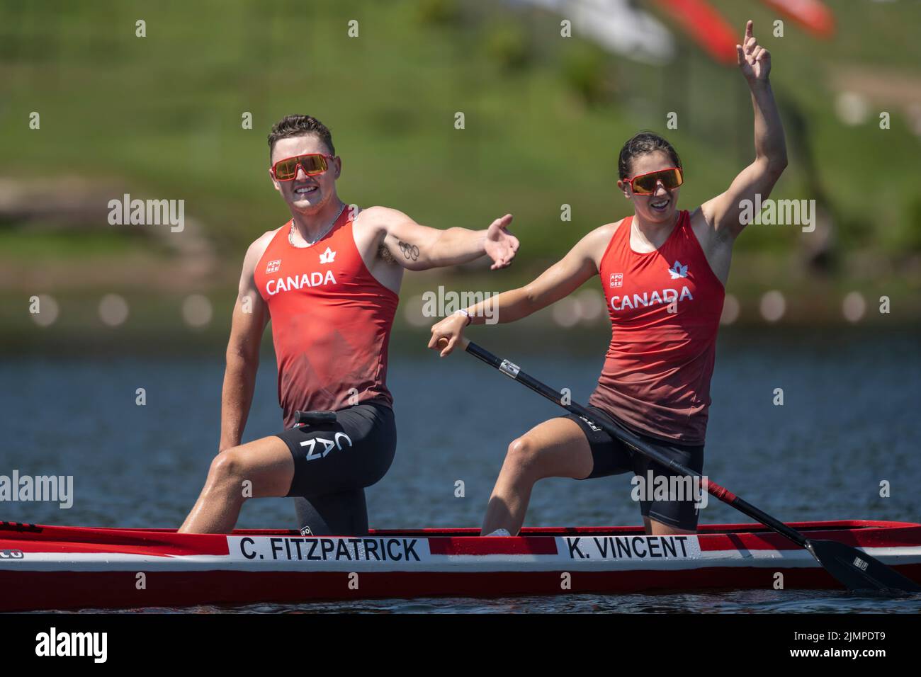 Connor Fitzpatrick, left, and teammate Katie Vincent, of Canada, react ...