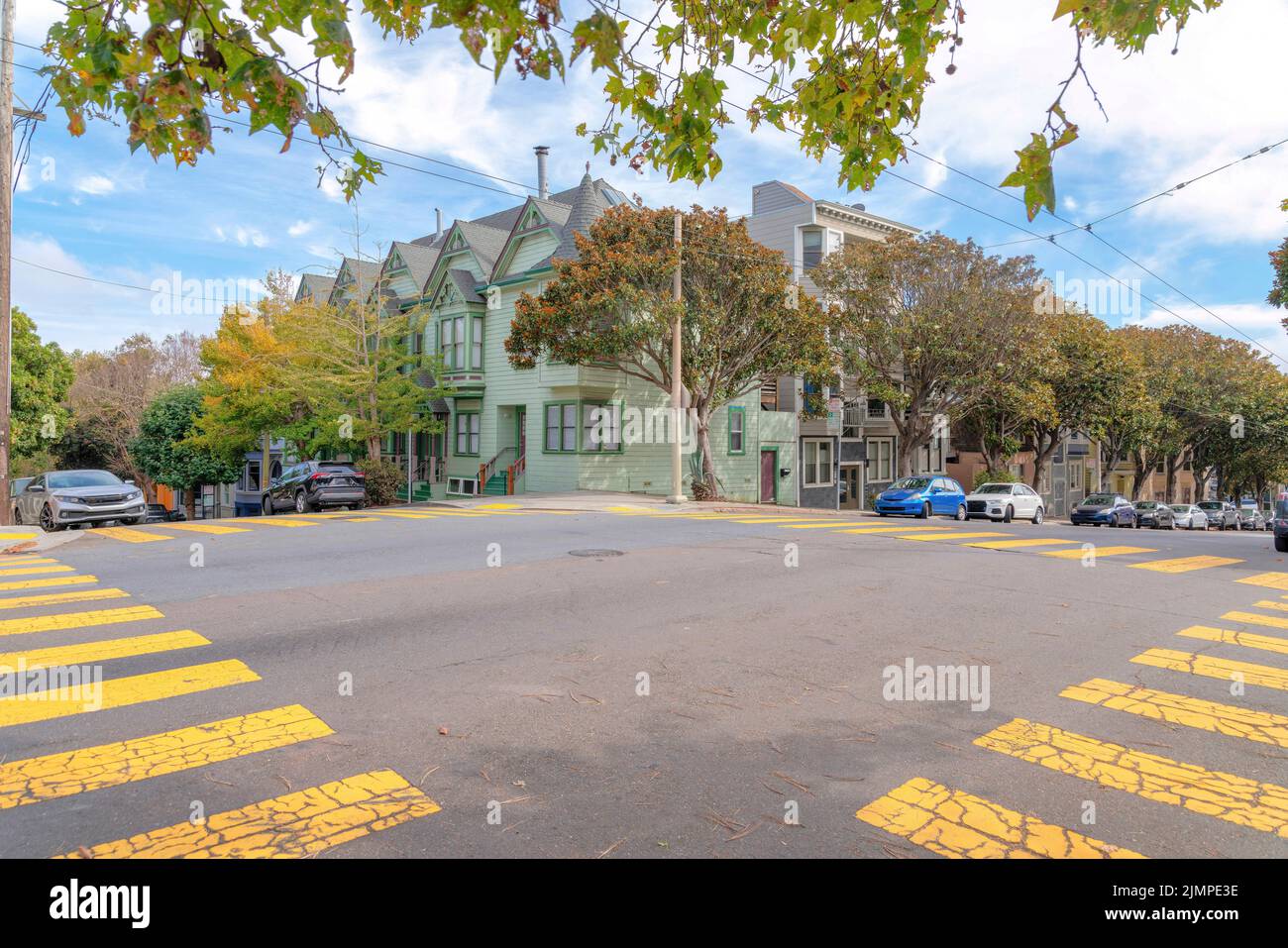 Intersection road with yellow pedestrian lanes in the suburbs of San ...