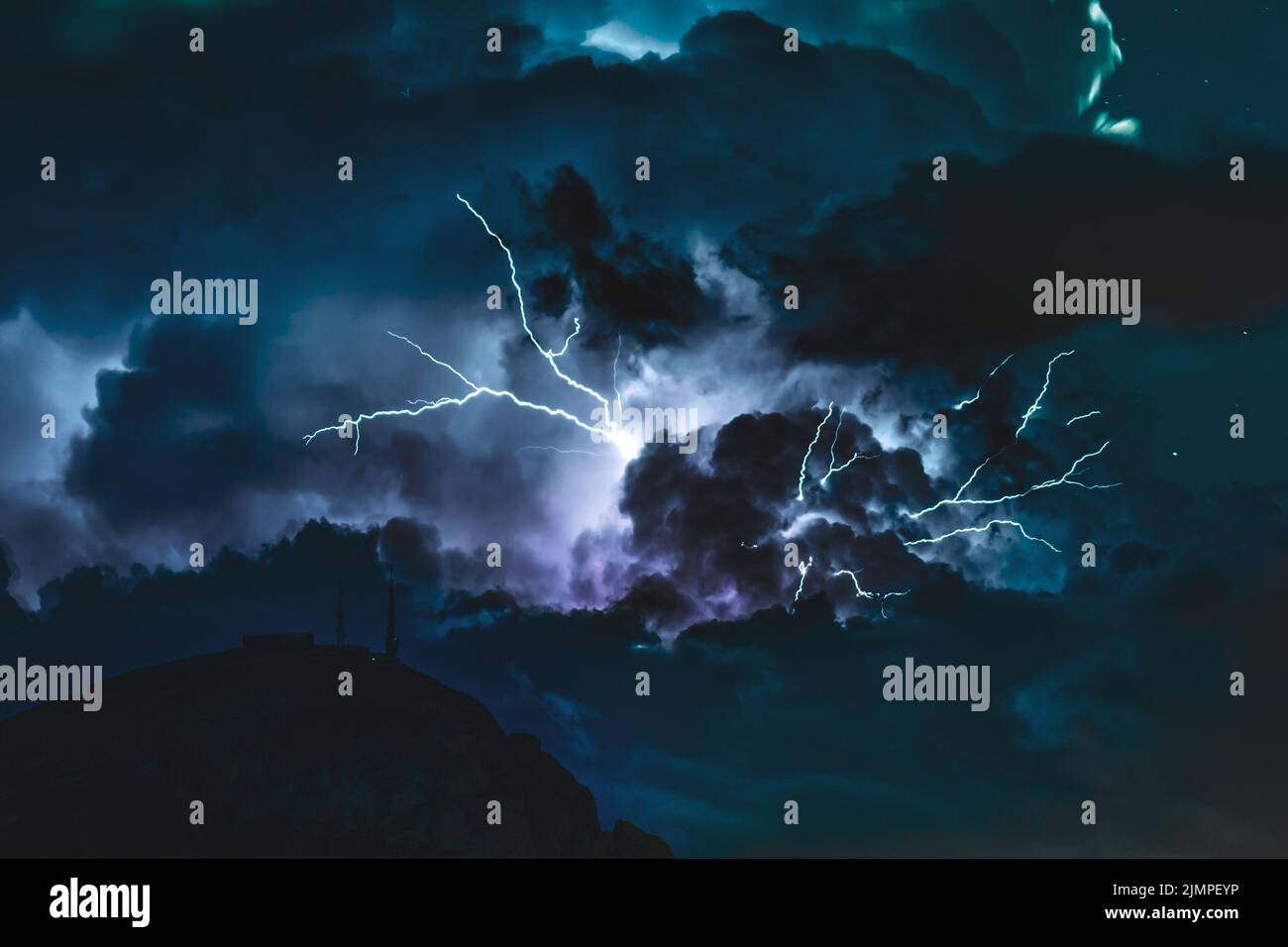 Huge lightning bolt during nightly thunderstorm in the Dolomites. Italy ...