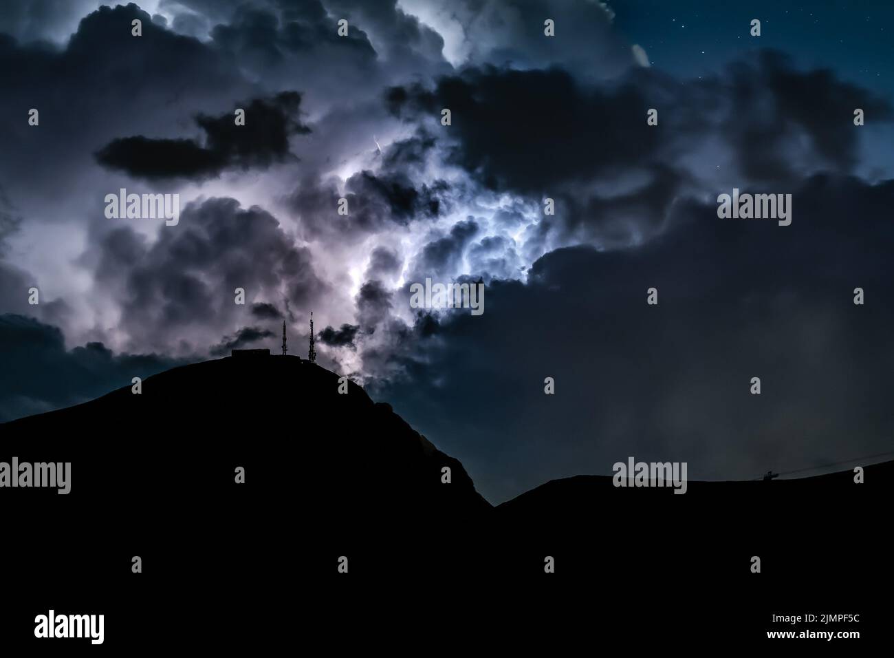 Lightning bolt during nightly thunderstorm in the Dolomites. Italy ...