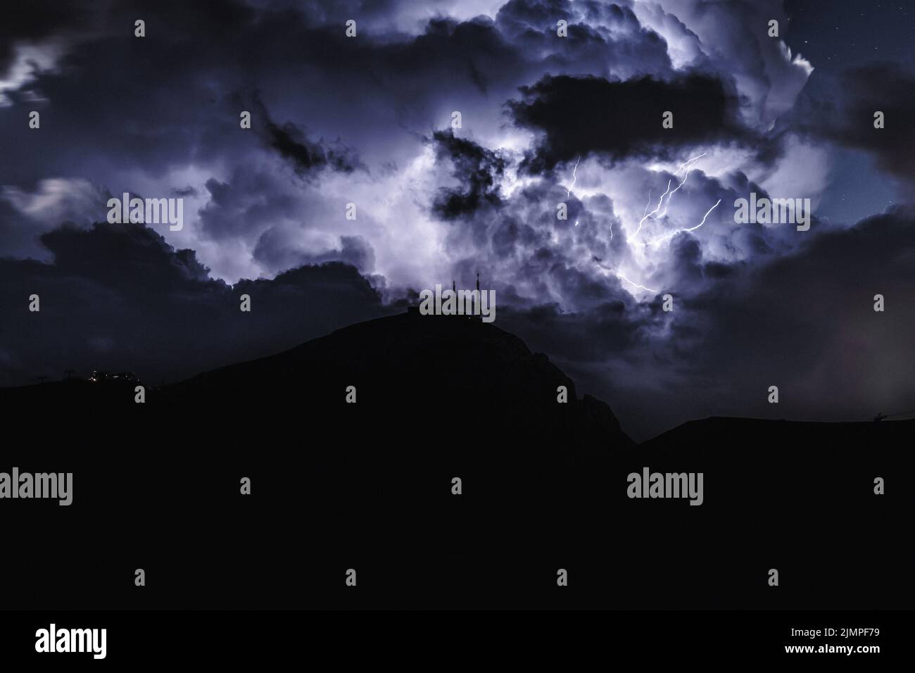Huge lightning bolt during nightly thunderstorm in the Dolomites. Italy ...